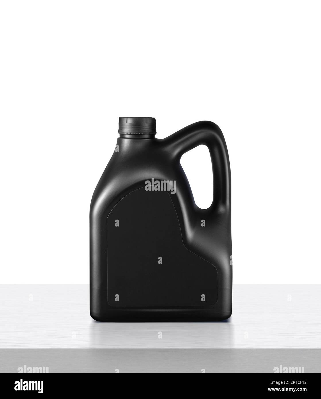 Bottle engine oil, on white wooden table Stock Photo - Alamy