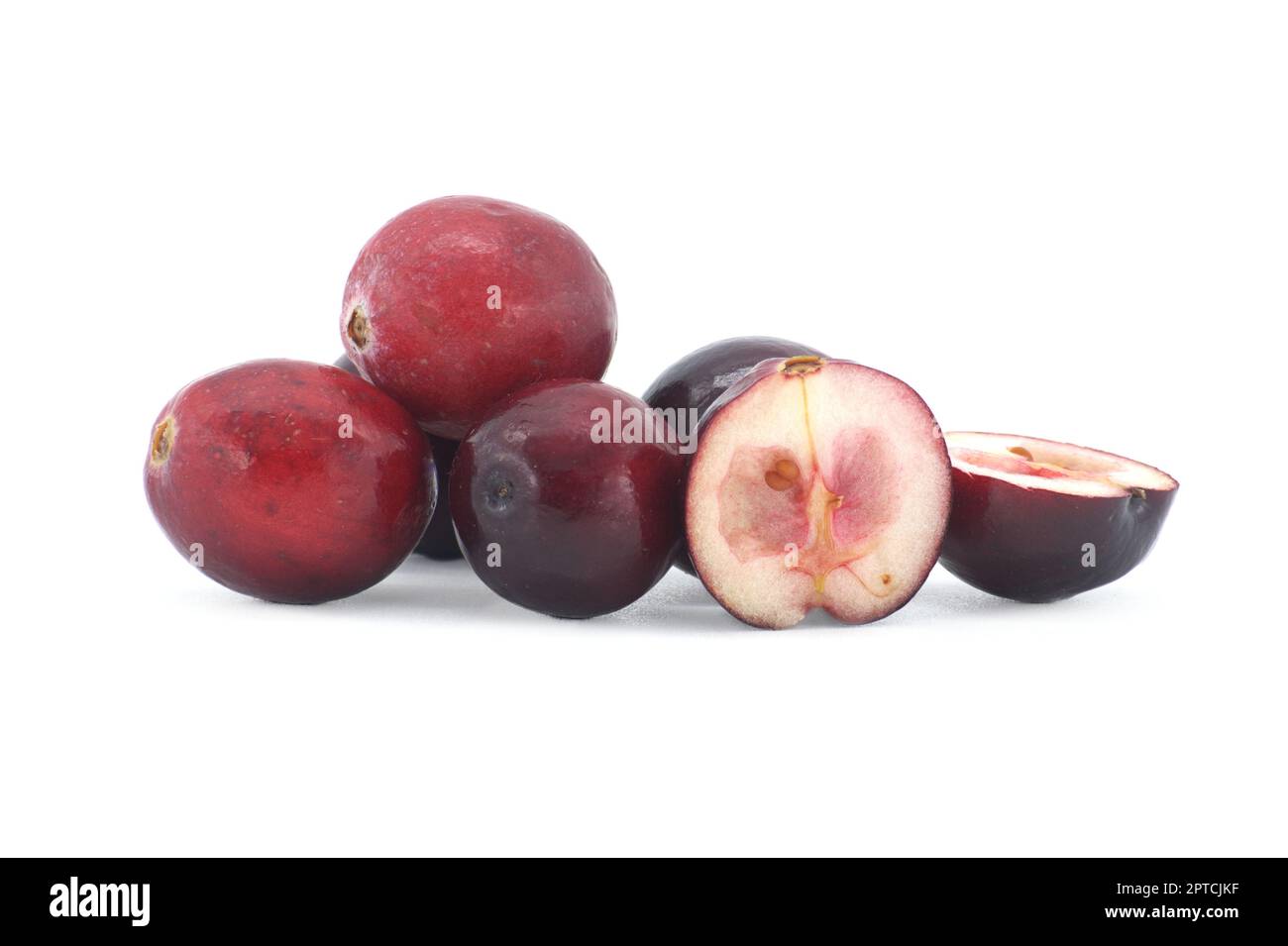 Fresh cranberries and cranberry berry cut in half isolated on white ...