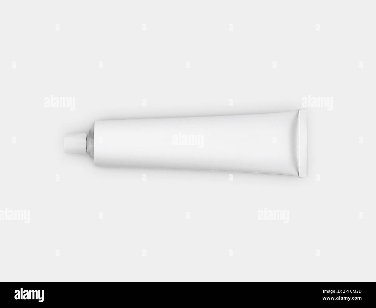 Top view, white tube with on a white background Stock Photo - Alamy