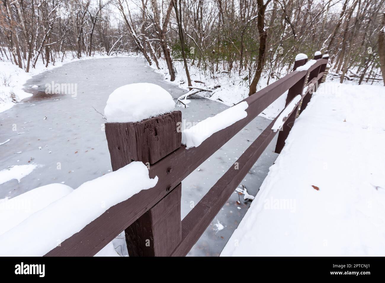 Rustic Bridge Over Frozen River In Winter Stock Photo - Alamy