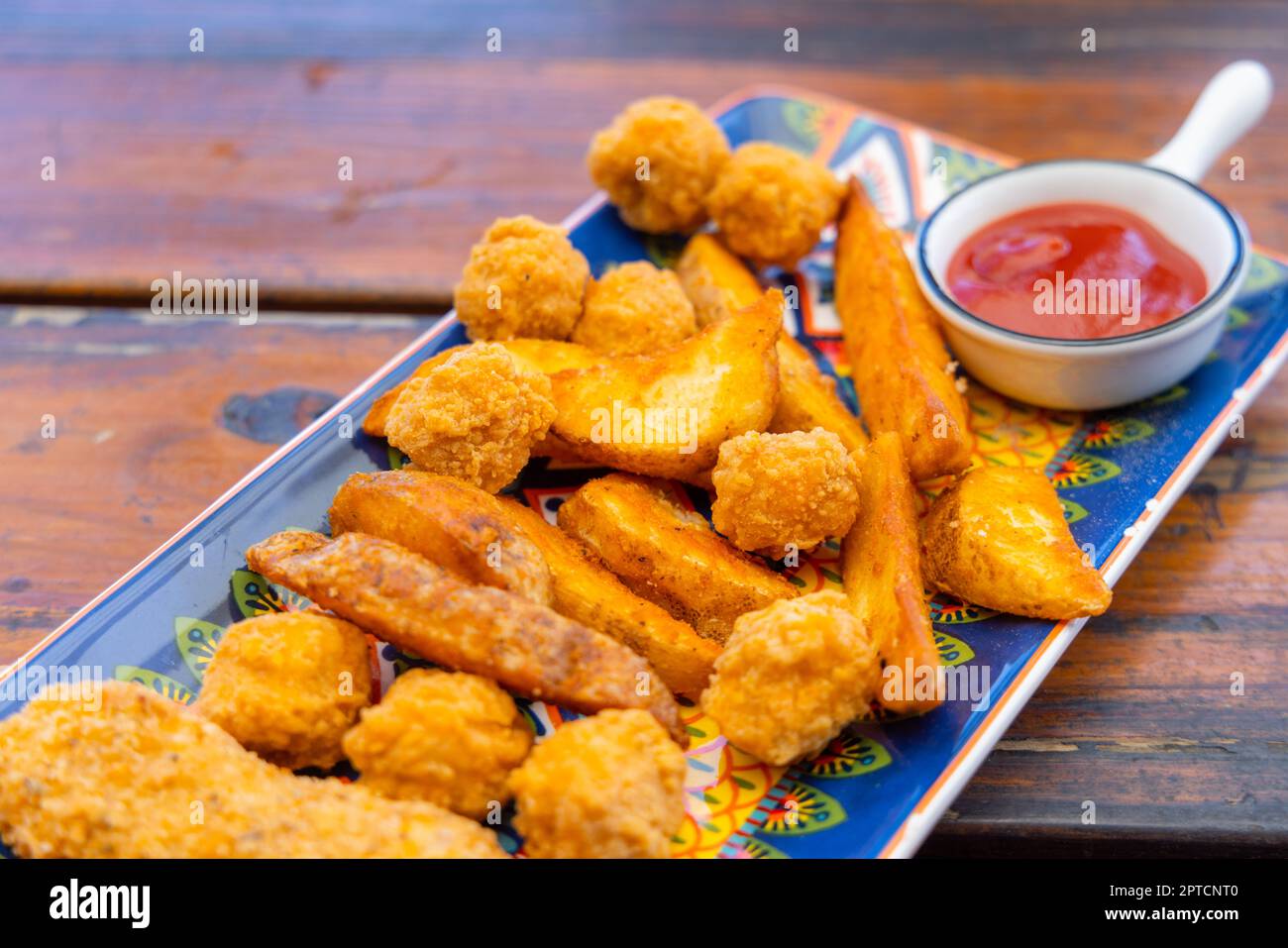 Fry fish finger and potato wedges Stock Photo - Alamy