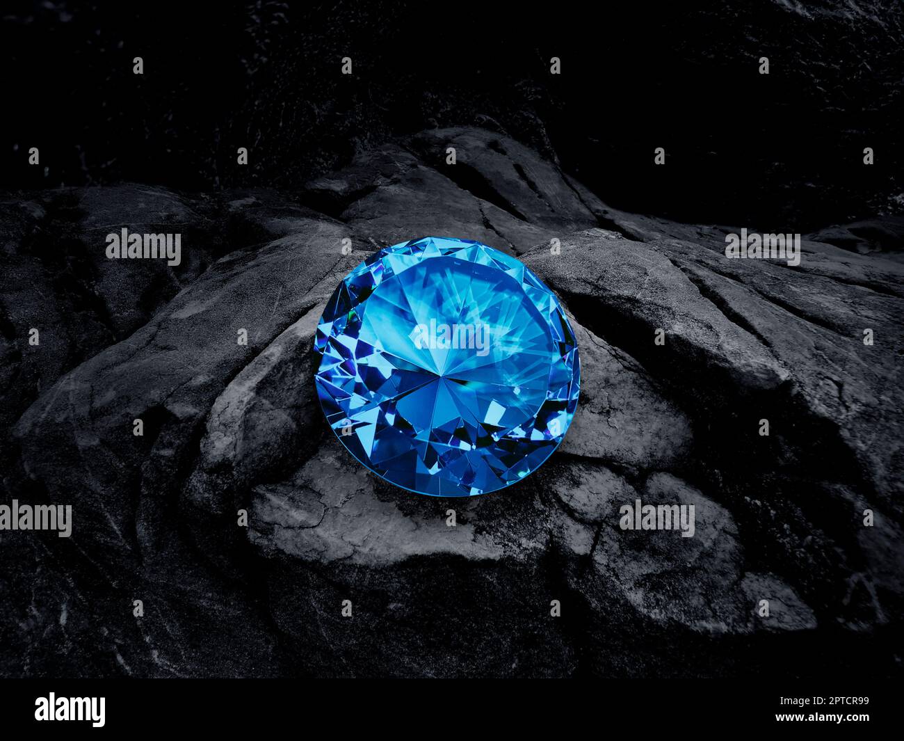 Blue diamond on black coal background Stock Photo - Alamy