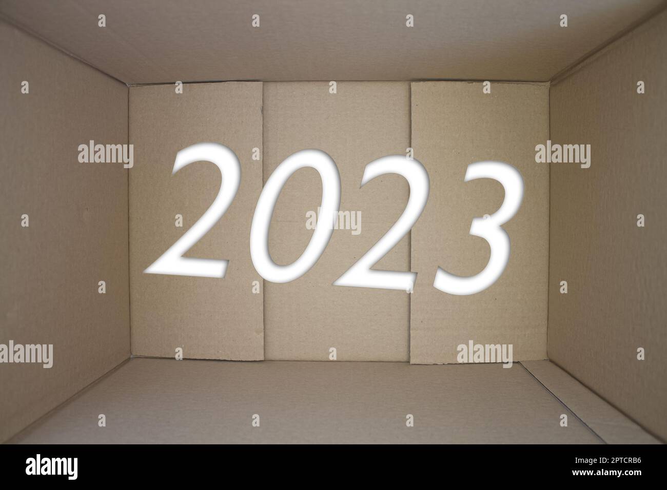 The number 2023 with cardboard box. Brown folded card box Stock Photo ...