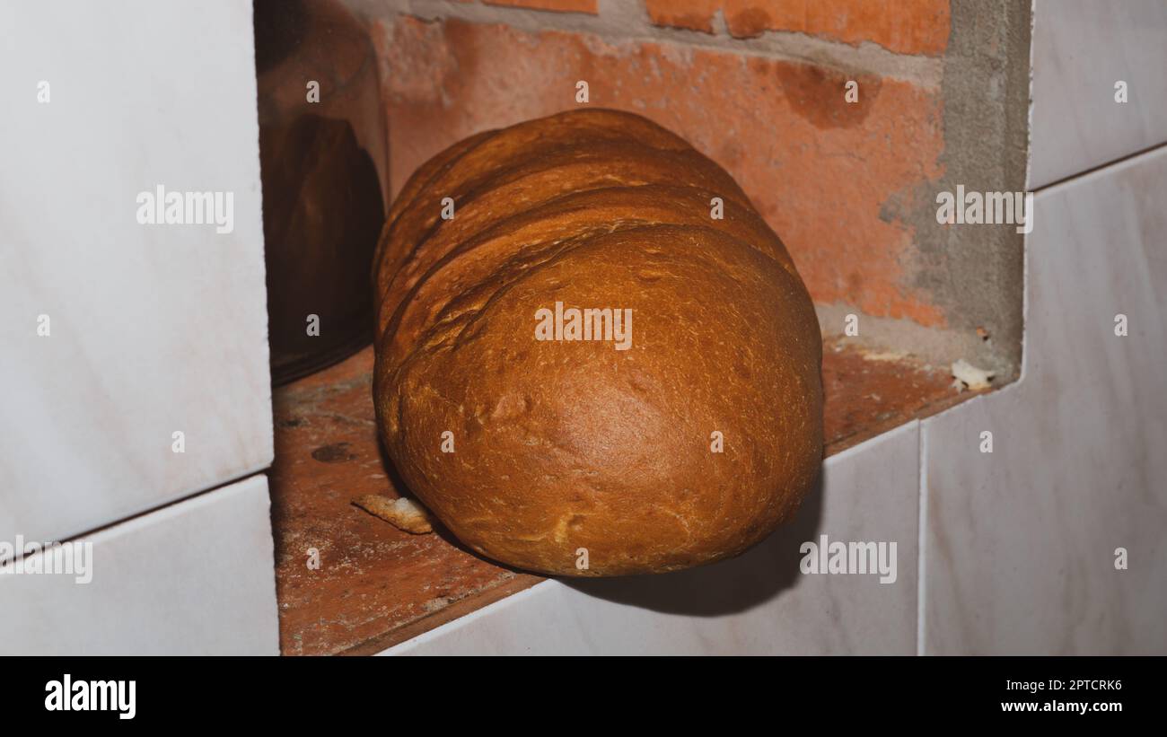 Long loaf in the ordinary stone stove close up Stock Photo - Alamy