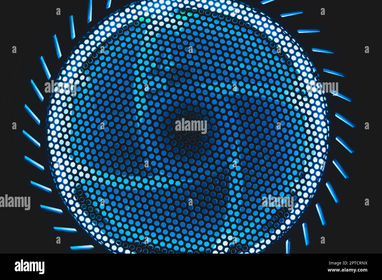 PC cooler fan with blue led lights illumination in the dark. abstract ...