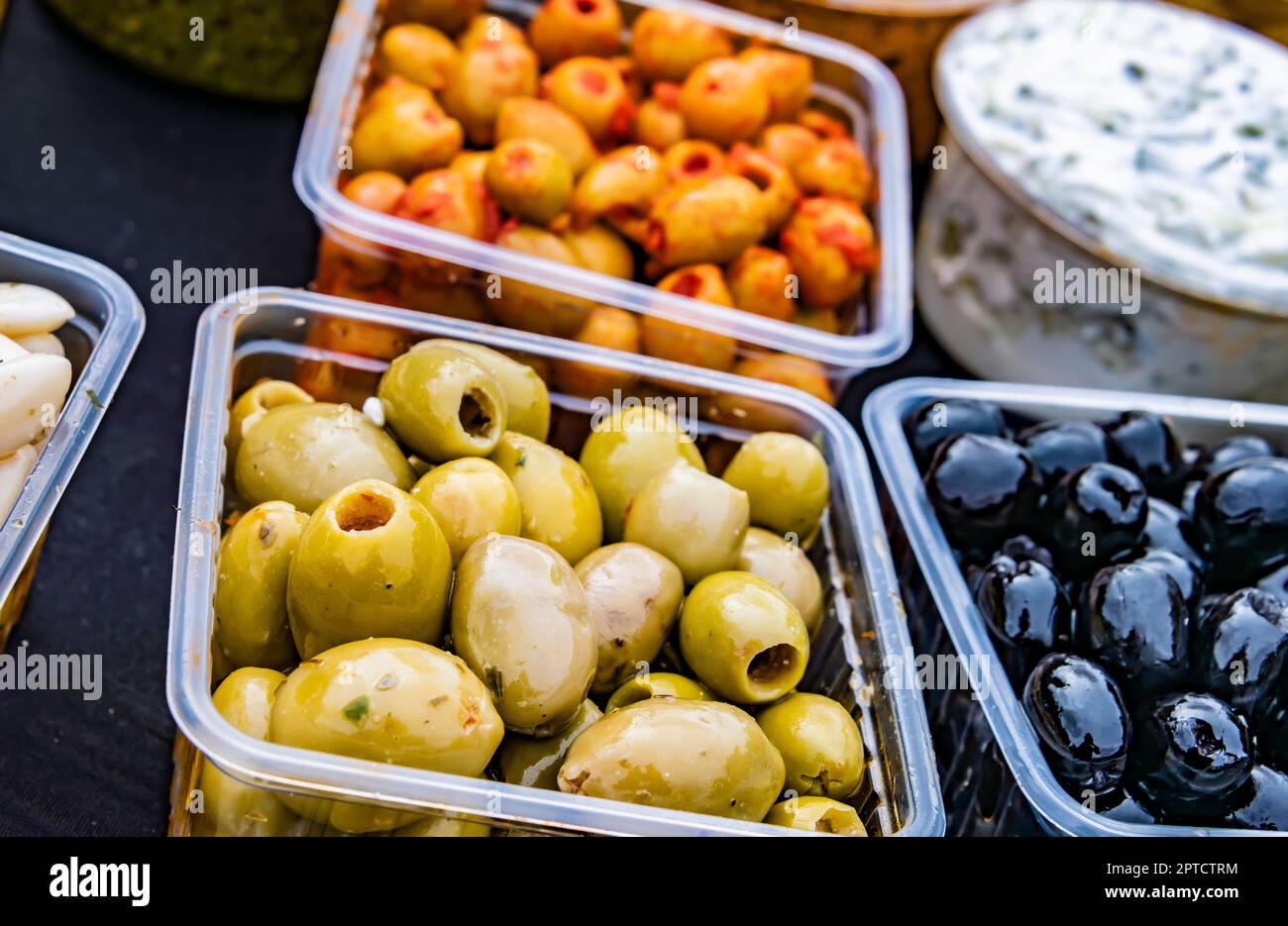 Olives in plastic boxes put up for sale in the store Stock Photo - Alamy