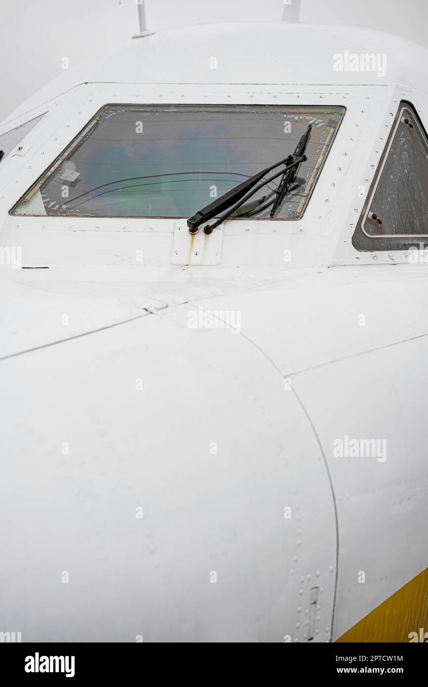 Close front outside view of a white jet plane cockpit Stock Photo - Alamy