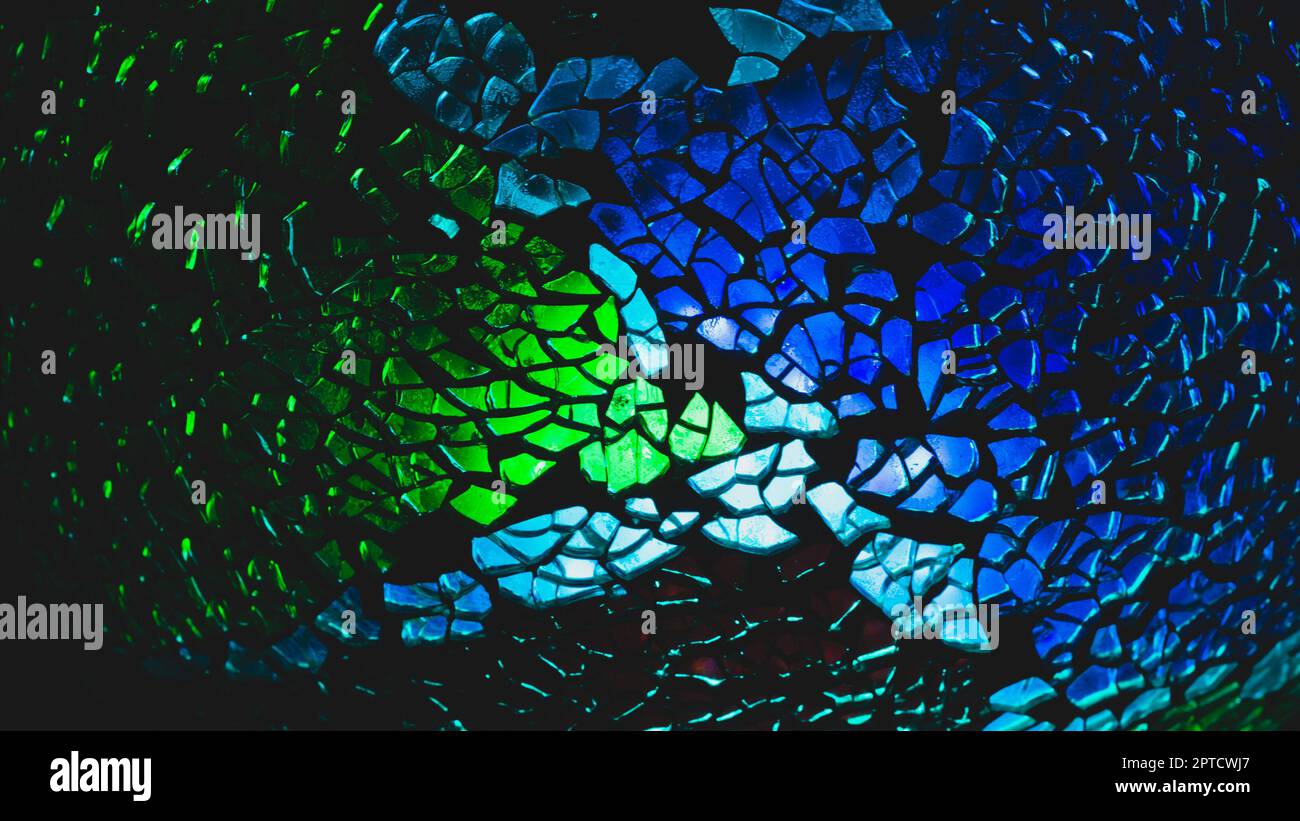 Shattered glass pattern in the dark. abstract cracked background. green ...