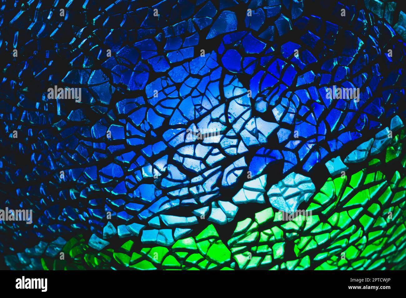 Shattered glass pattern in the dark. abstract cracked background. green ...