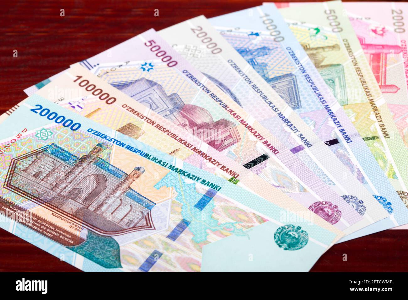 Uzbekistani money - Som a business background Stock Photo - Alamy