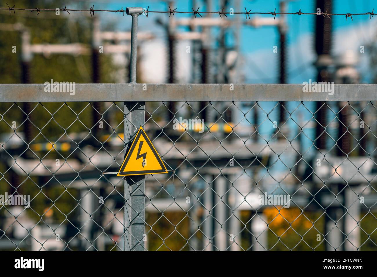 Electrical hazard sign placed on a fence of an high-voltage substation ...