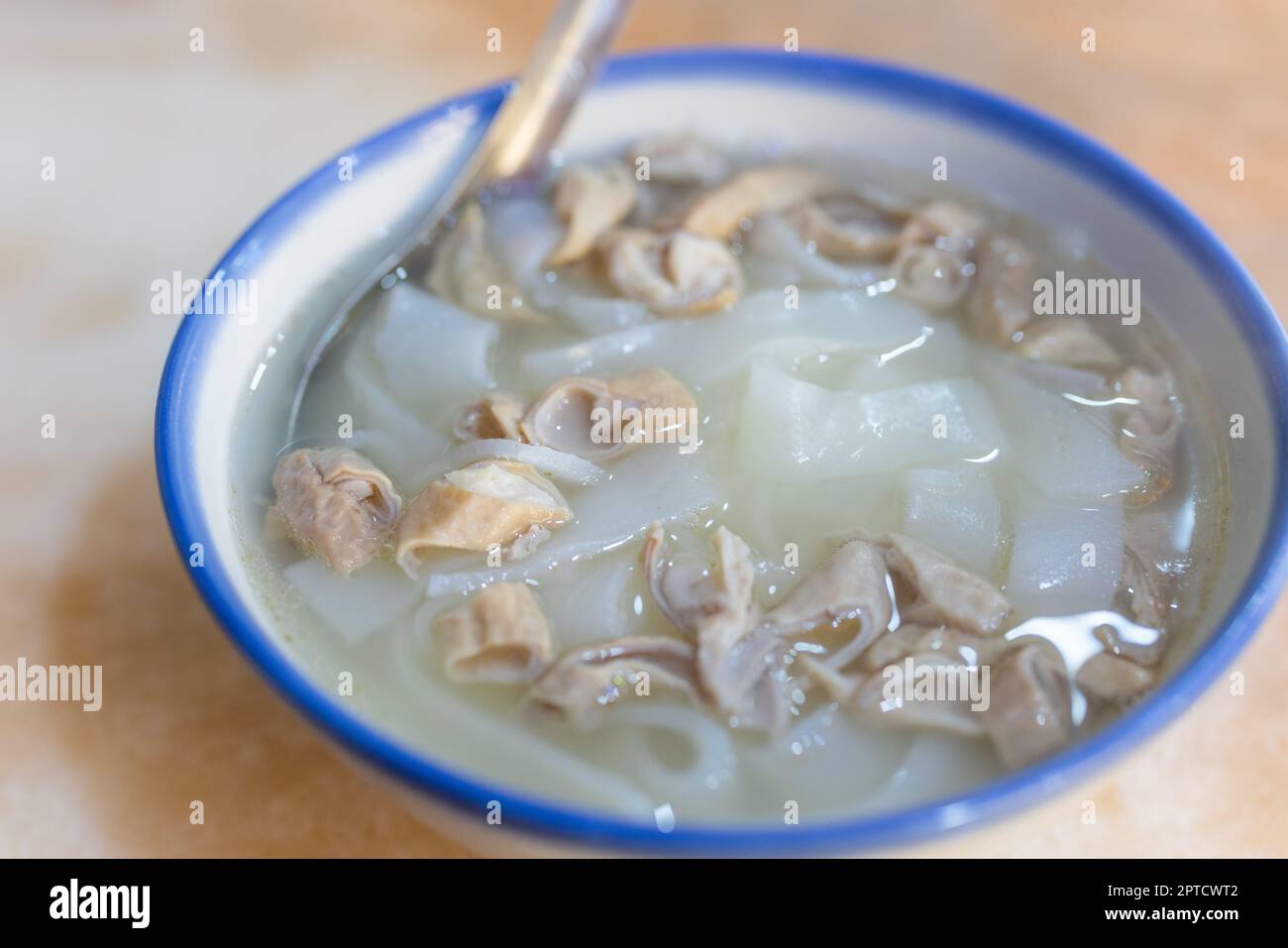 Pork intestine rice flat noodle in restaurant Stock Photo - Alamy
