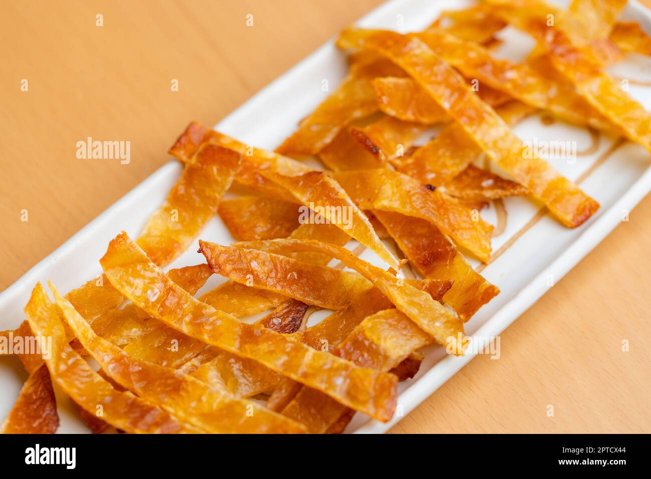 Cooked dried fish fillet snack Stock Photo - Alamy