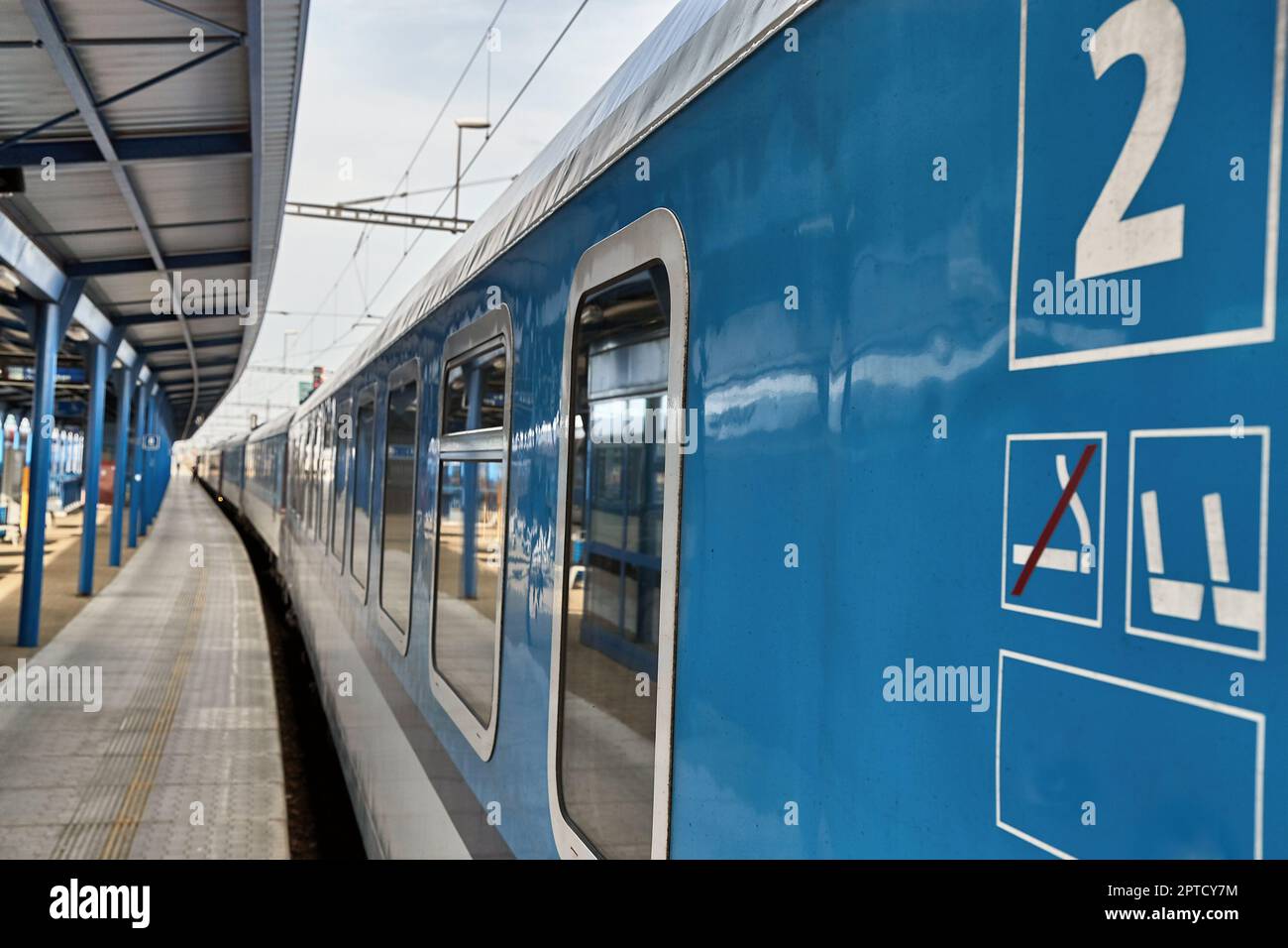 Passanger train at a station platform Stock Photo - Alamy