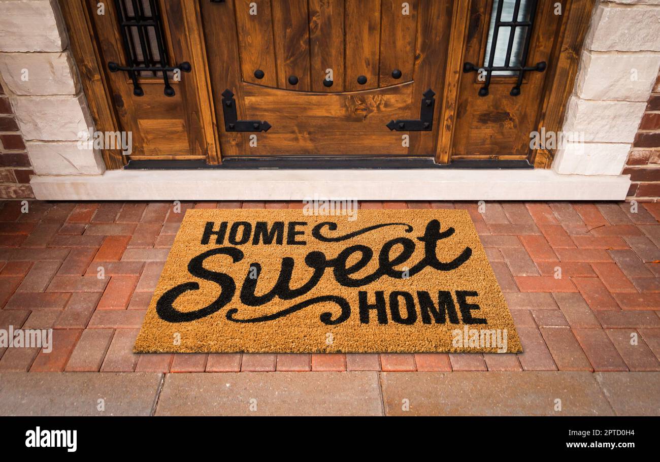 Home Sweet Home Welcome Mat At Custom Front Door of House Stock Photo ...