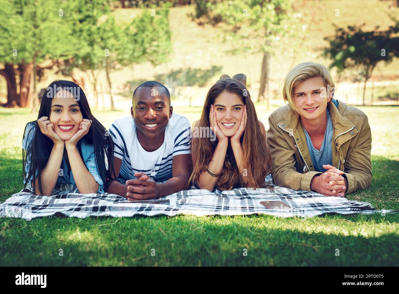 The best kind of people to chill with. Portrait of a group of young ...