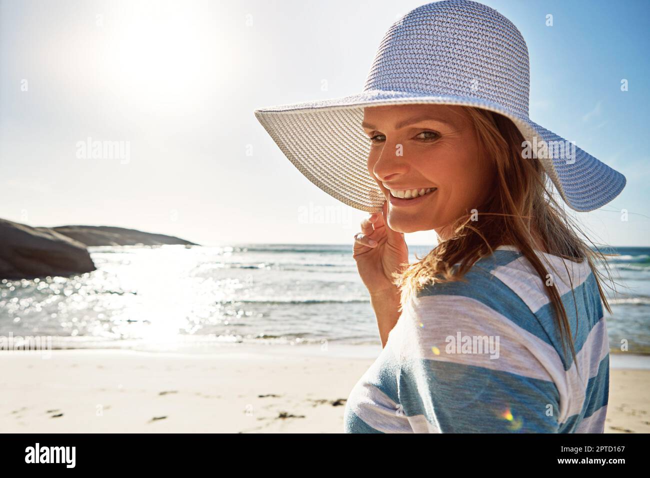 Youll never regret a day spend at the beach. an attractive mature woman ...