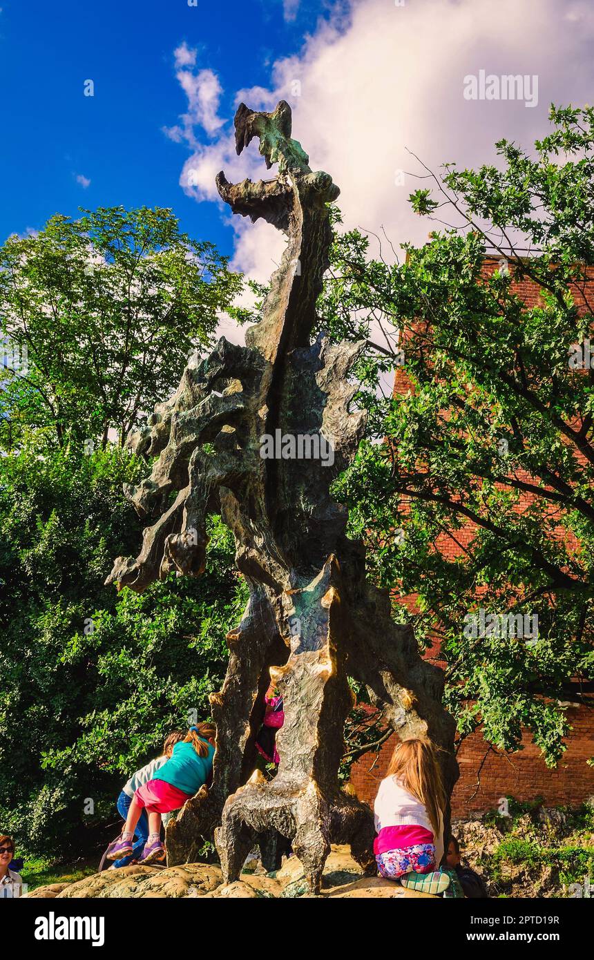Krakow, Poland - August 16, 2014: Tourists visiting the statue of Wawel ...
