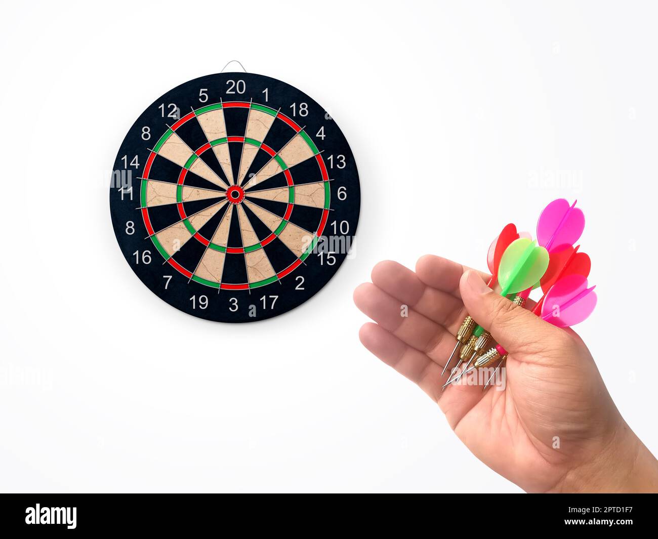 Human hand is throwing the darts target to the darts board. a man's ...