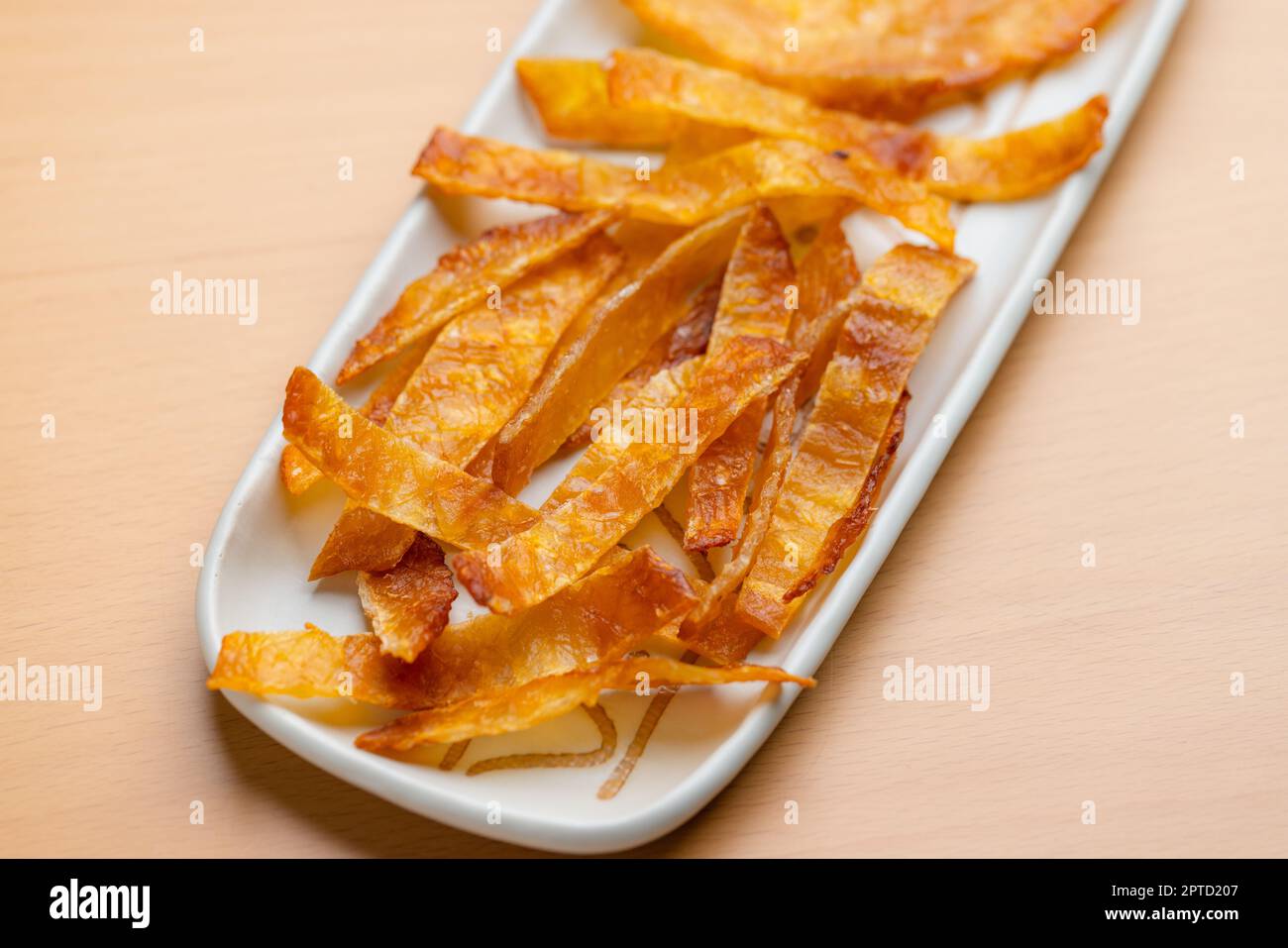 Cooked dried fish fillet snack Stock Photo - Alamy