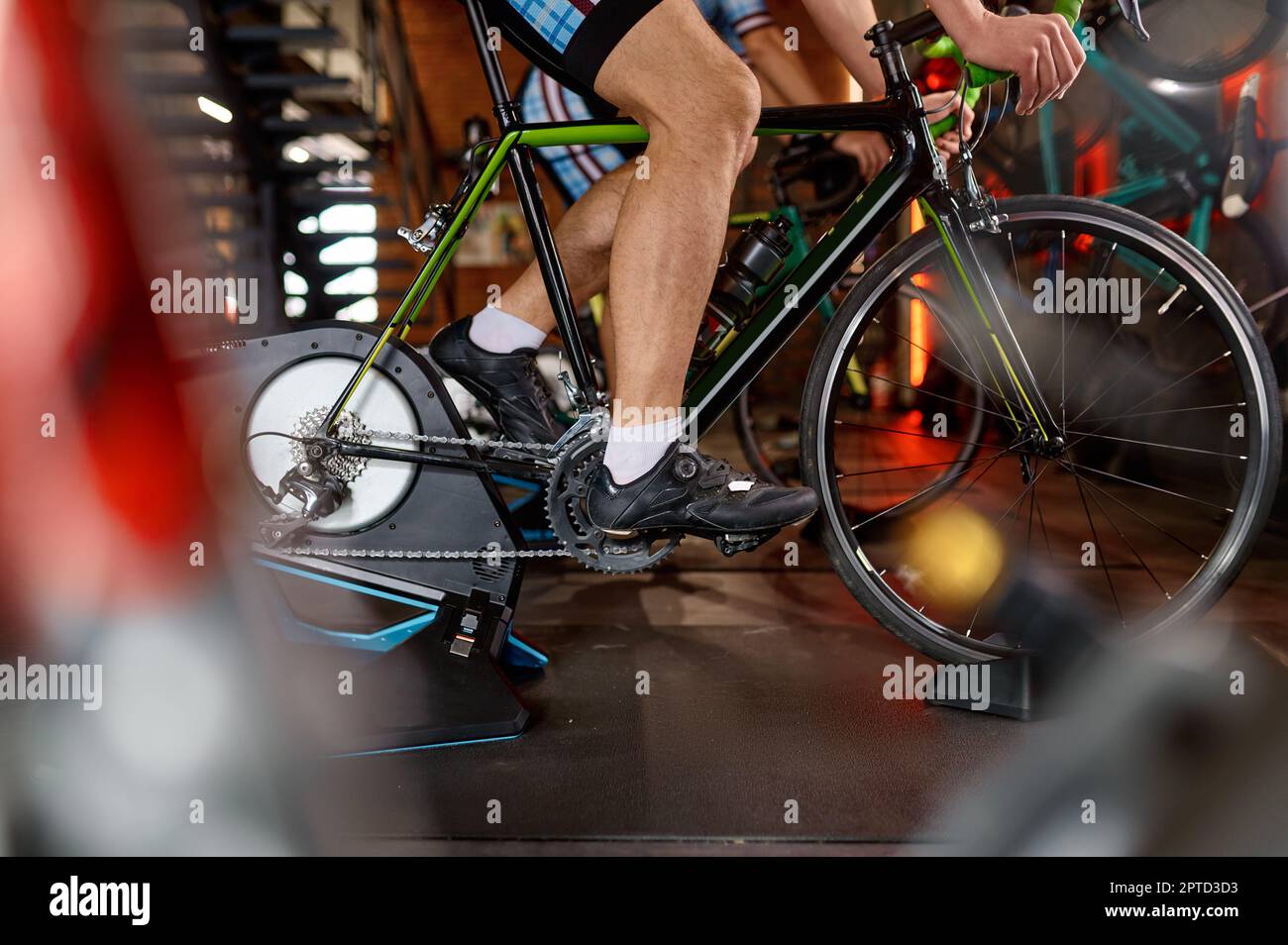Man cycling shot. Closeup on male leg pedaling. Fitness cardio workout ...