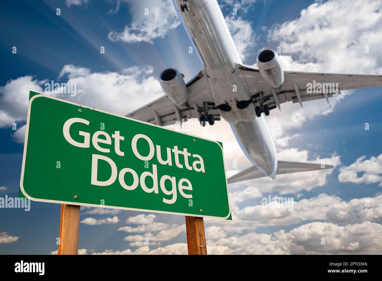 Get Outta Dodge Green Road Sign Against Dramatic Clouds and Sky Stock ...