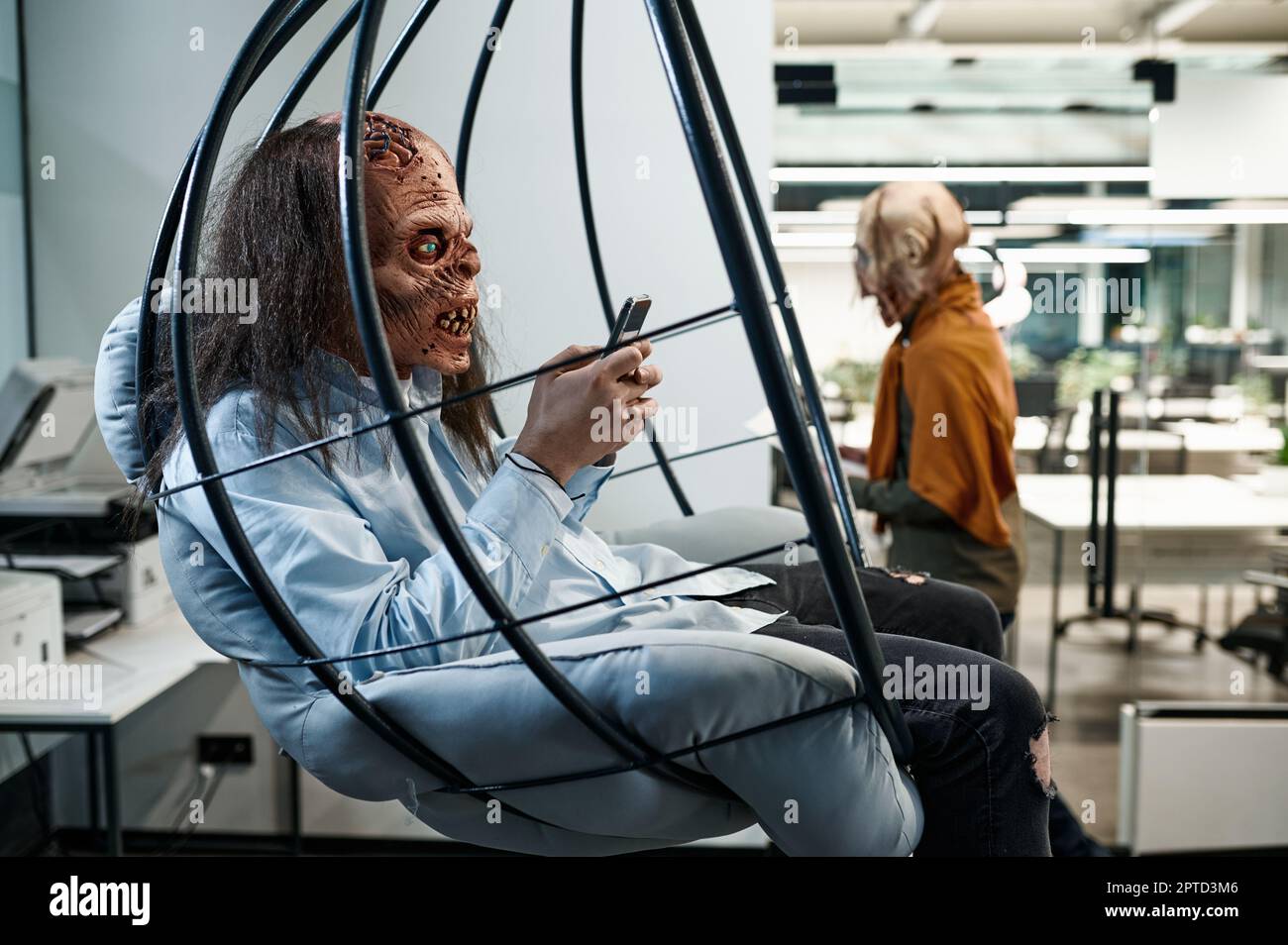 Zombie employee chatting social network in lounge area. Coworking ...