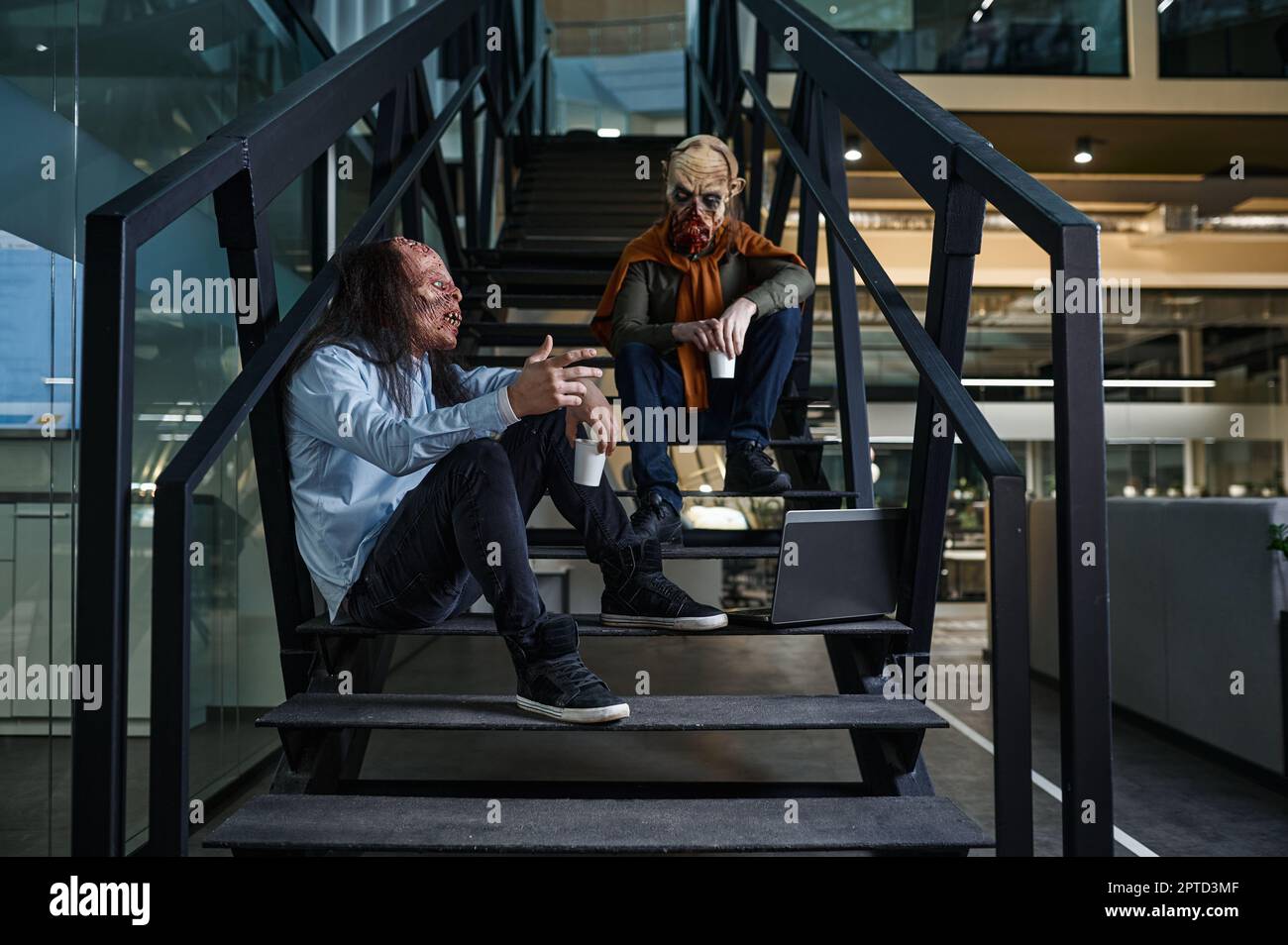 Zombie workers drinking coffee chatting sharing idea on staircase enjoy ...