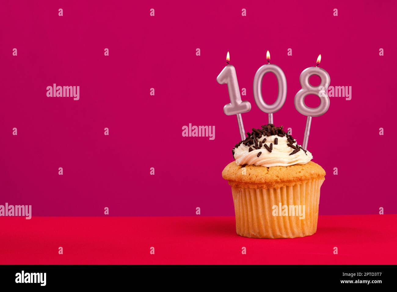 Candle number 108 - Cake birthday in rhodamine red background Stock ...