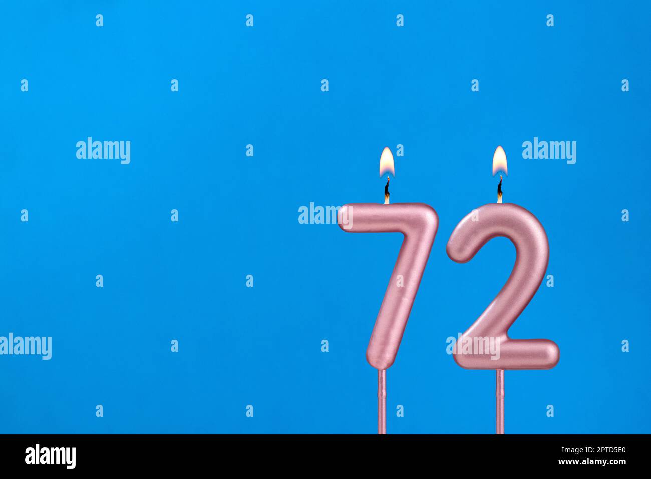 Candle number 72 - Birthday in blues foamy background Stock Photo - Alamy
