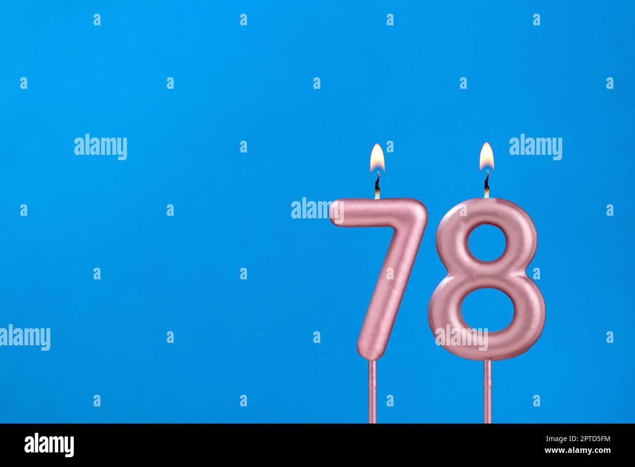 Candle number 78 - Birthday in blues foamy background Stock Photo - Alamy