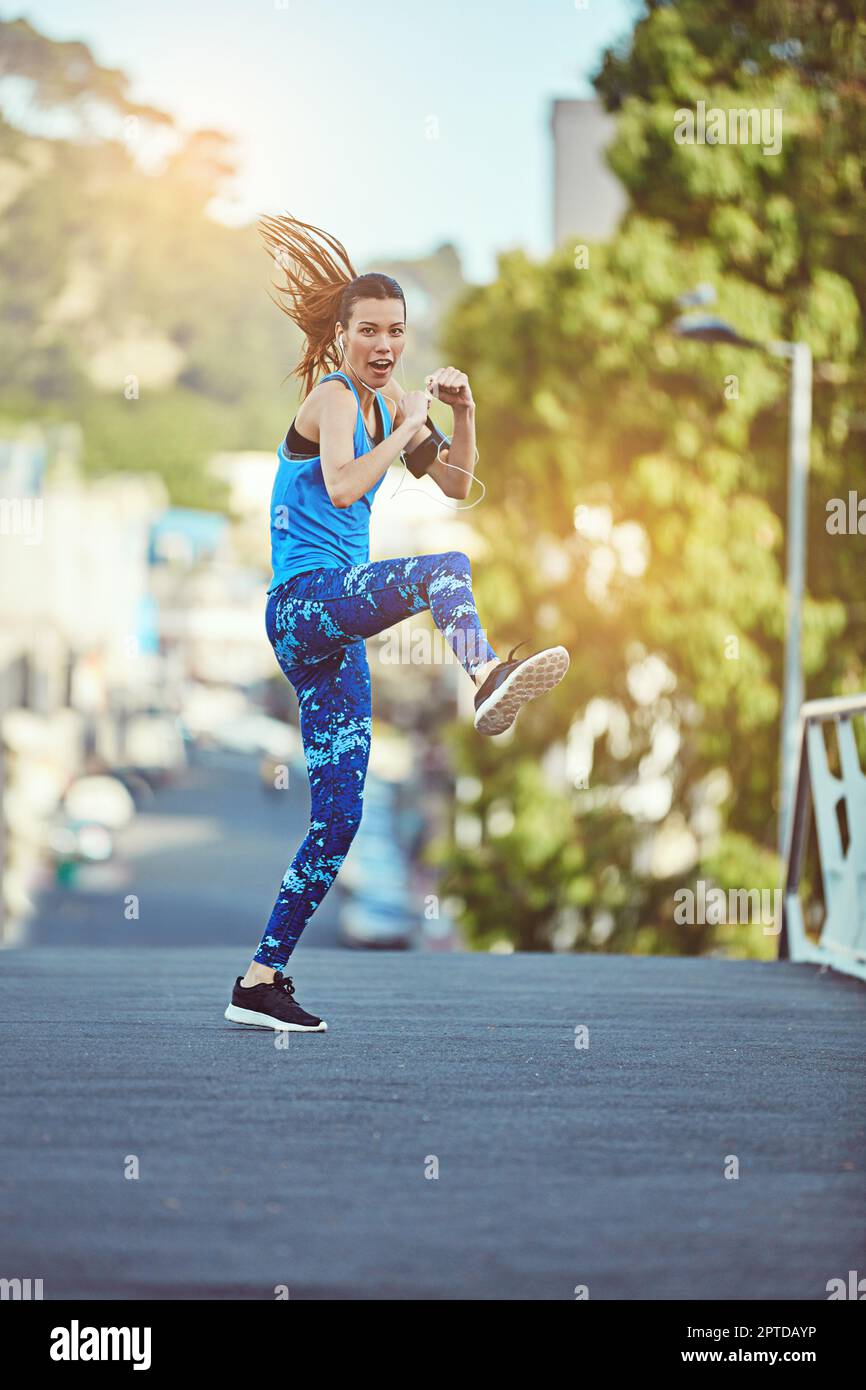 I put the kick in kicking butt. young woman working out in the city ...