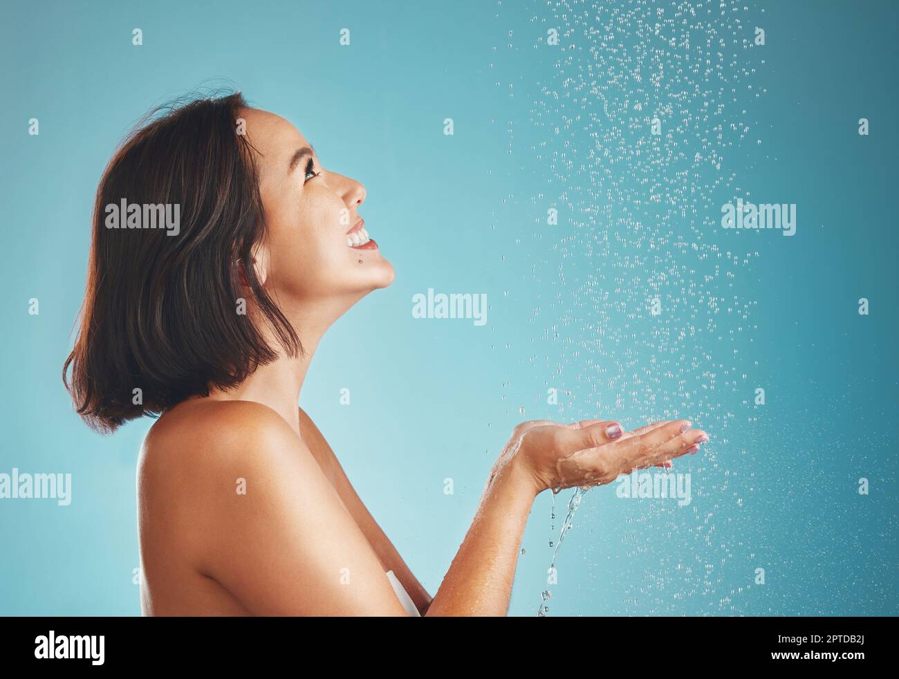 Shower, woman and water splash in studio for cleaning, wellness and ...