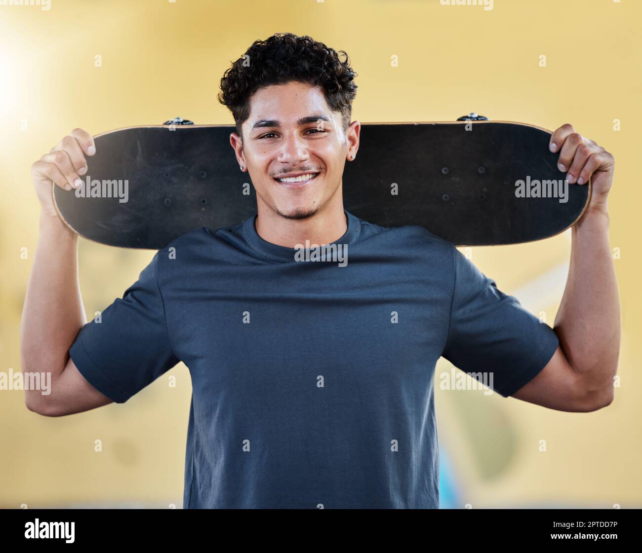 Portrait, skater and skateboard happy man, smile and confident to ...