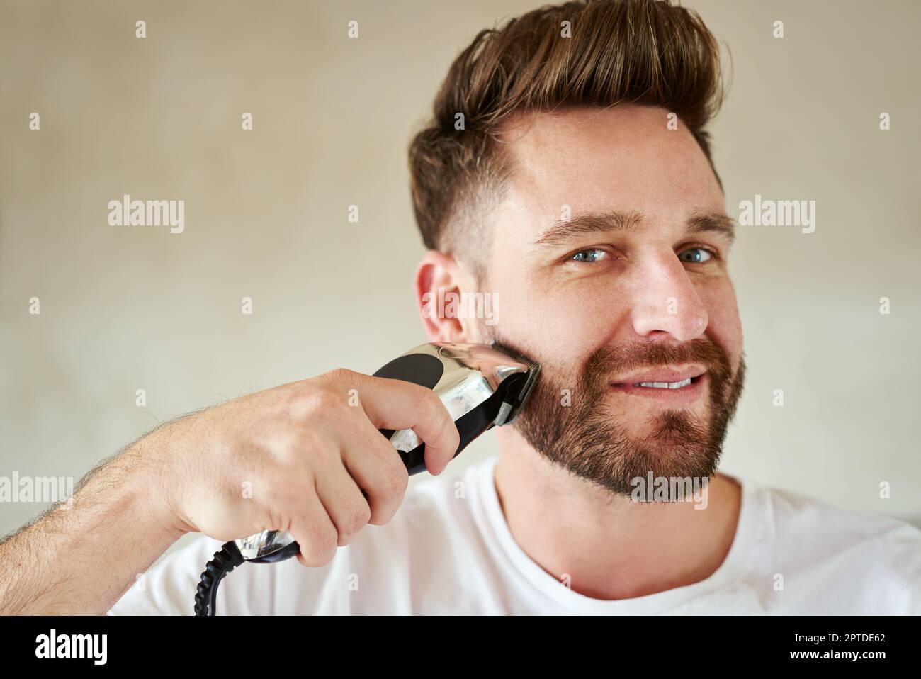 The start of my daily grooming routine. a handsome young man going ...