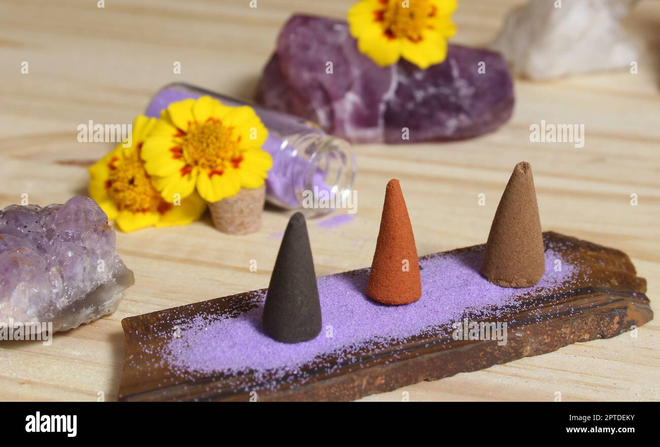Incense Cones on Stone Slab With Rock Crystals and Flowers Stock Photo ...