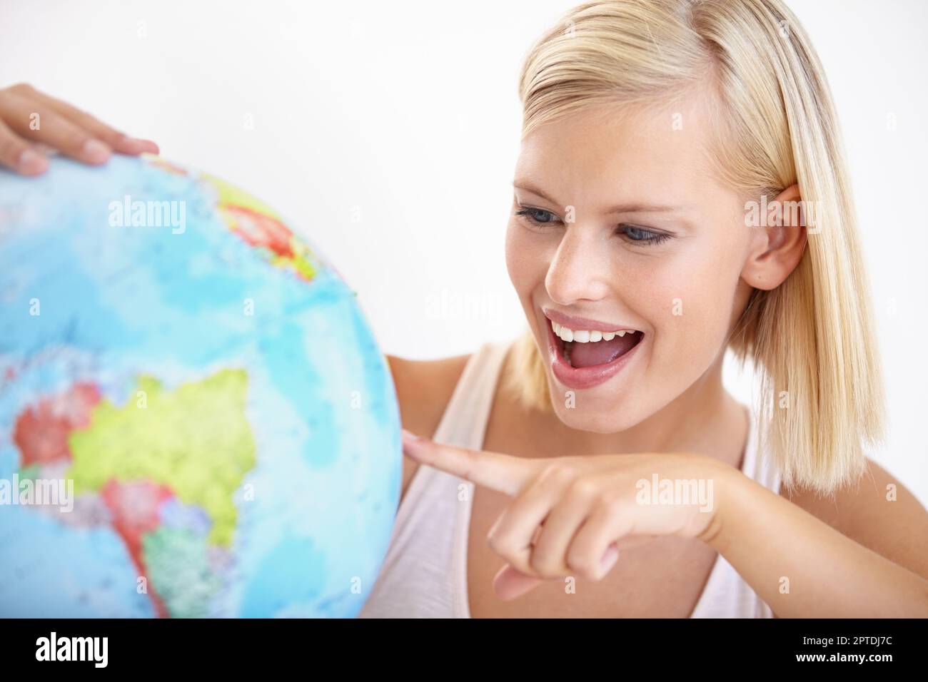 My next destination. A pretty young woman pointing at her next ...