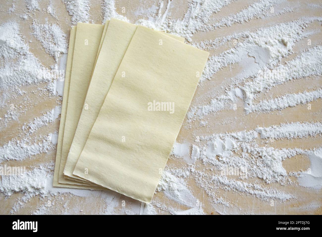 preparation of lasagna on a pastry board with flour Stock Photo - Alamy