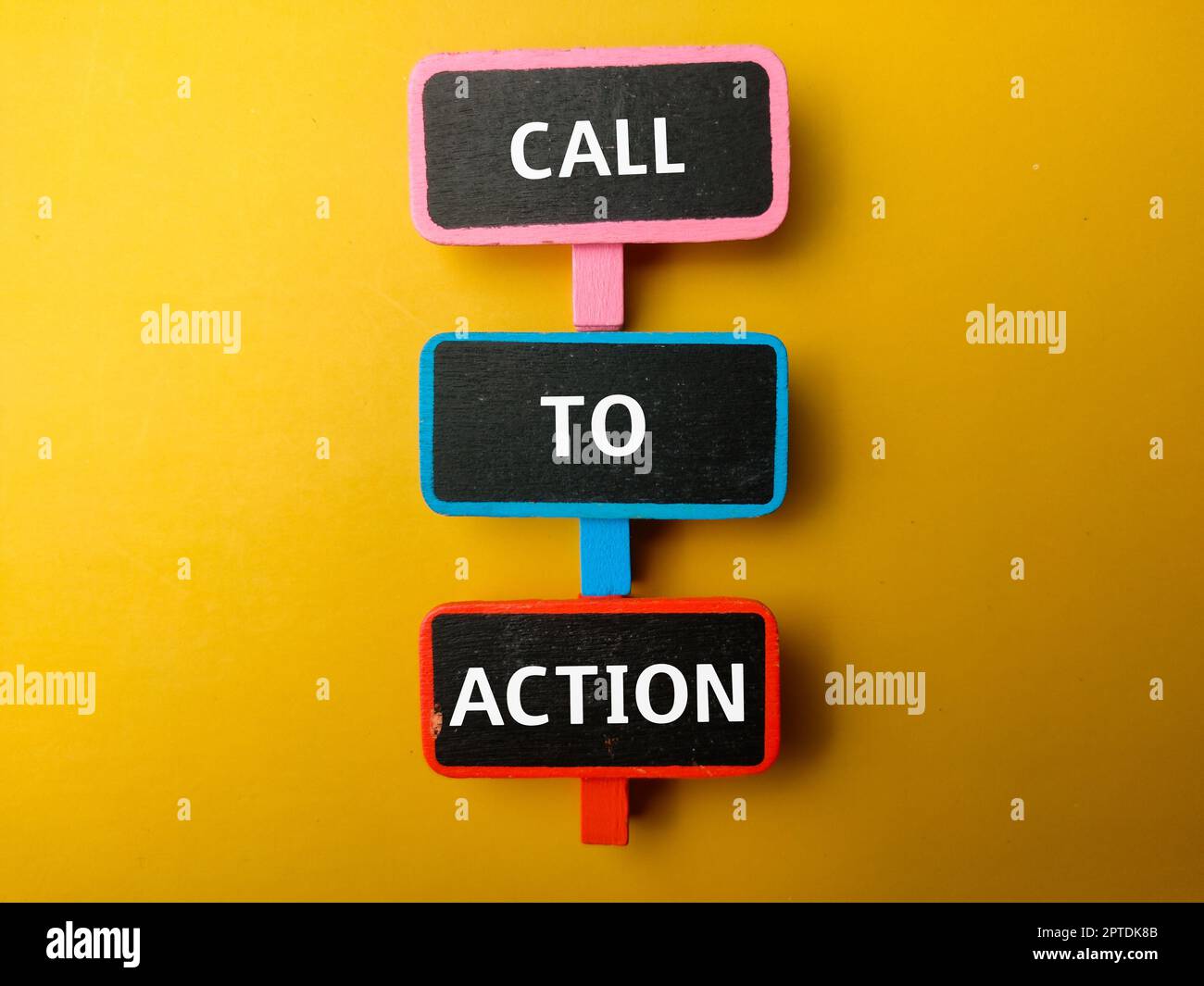 Colored wooden board with the word CALL TO ACTION on yellow background ...