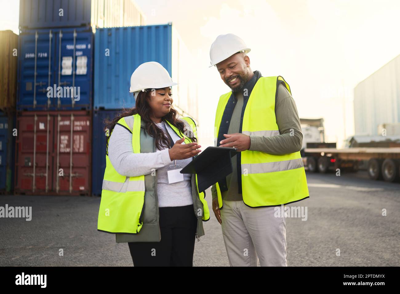Logistics, tablet and black woman and man in container shipping yard ...