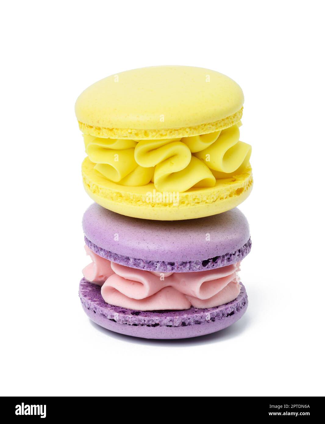 Two baked macarons on a white isolated background Stock Photo - Alamy