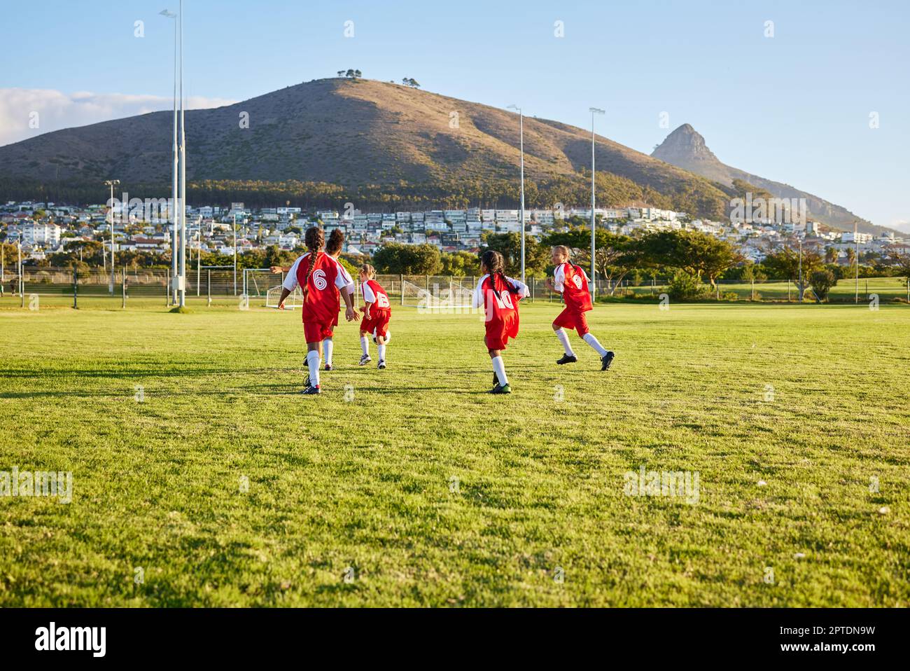Girls playing soccer in field hi-res stock photography and images - Alamy