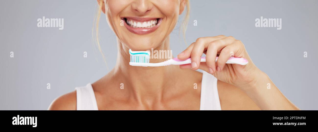 Dental, health and woman use toothbrush and toothpaste to clean teeth ...