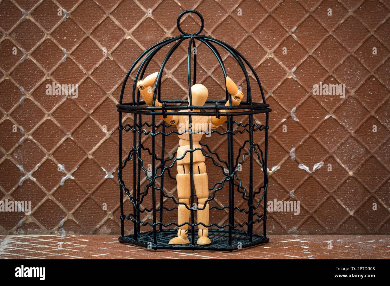 Man Trapped, Prisoner in Cage.Wooden mannequin inside a birdcage ...