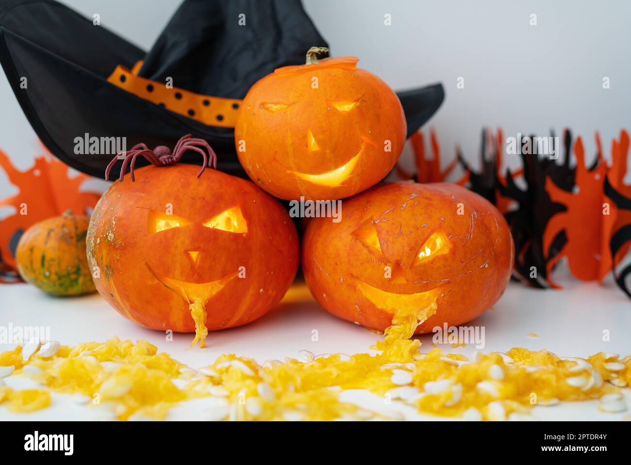 October 31. Holiday Halloween. Carved face of a pumpkin on an orange ...