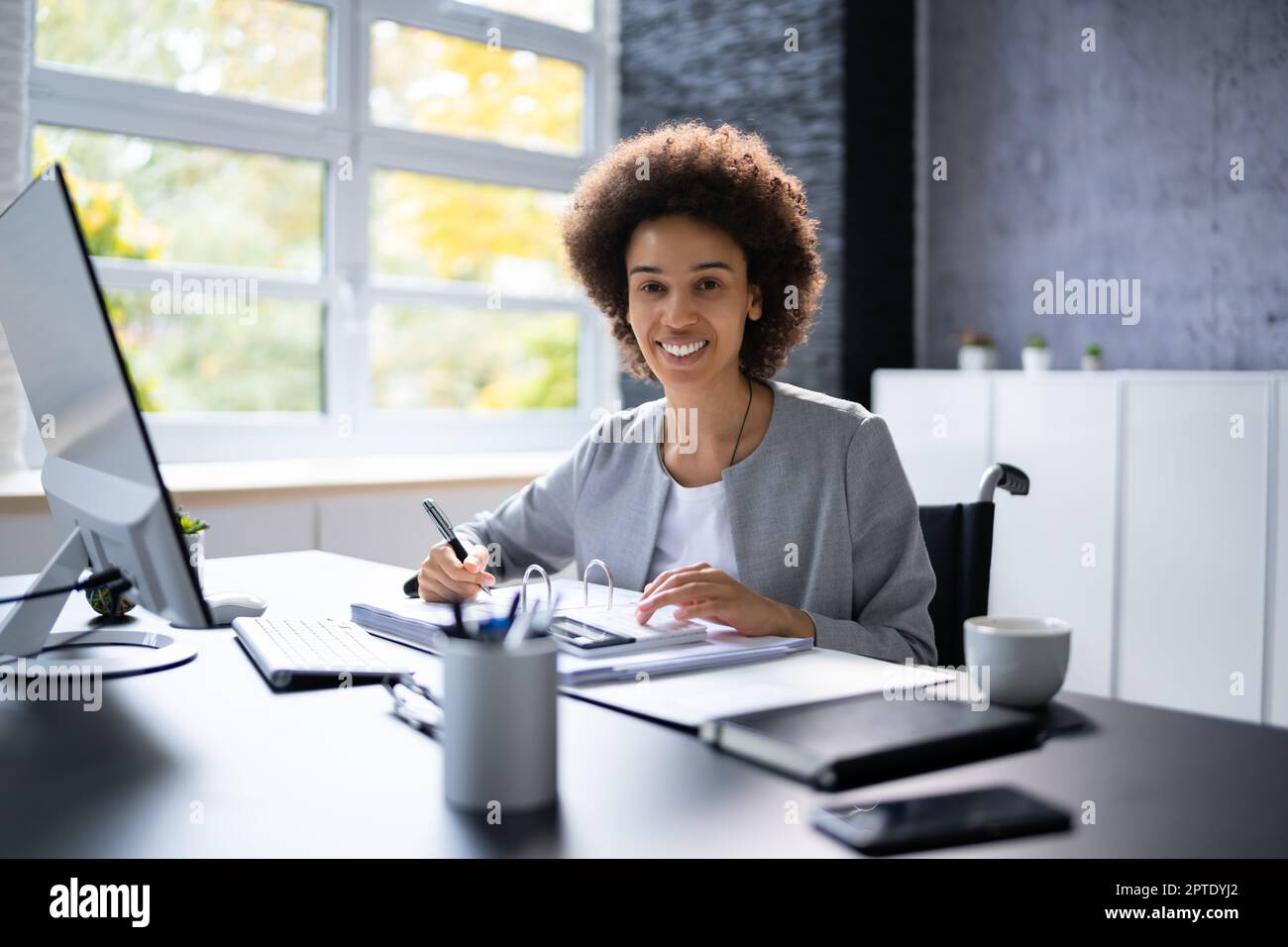 Girl wheelchair calculator hi-res stock photography and images - Alamy
