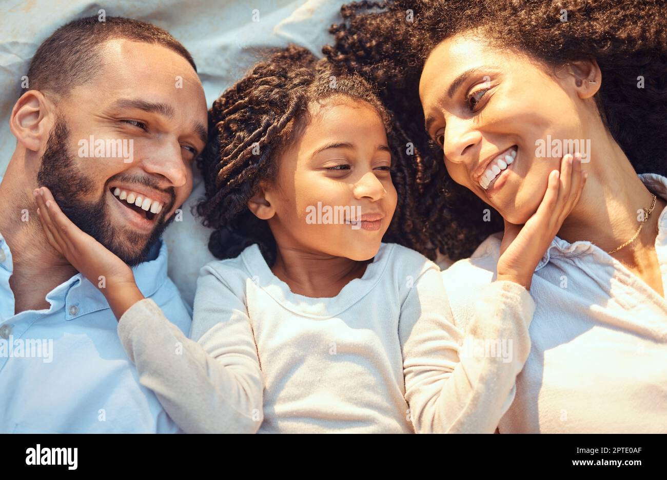 Kids waking up parents in bed hi-res stock photography and images - Alamy