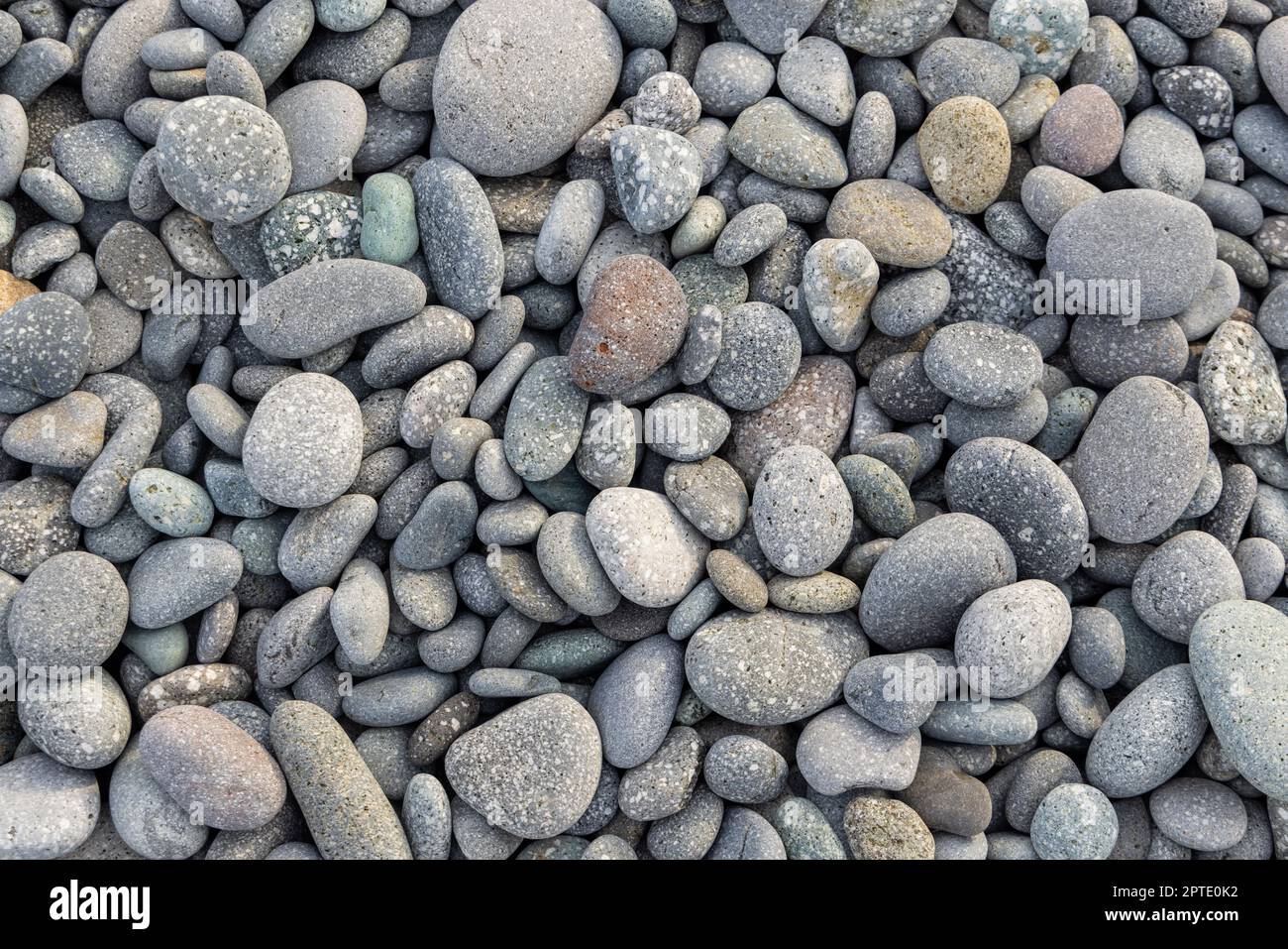 Pebble stone pattern texture background Stock Photo - Alamy
