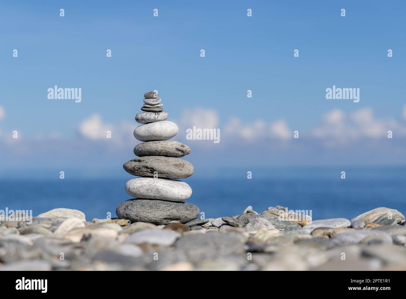Pebble tower balance harmony stones arrangement on sea beach coastline ...