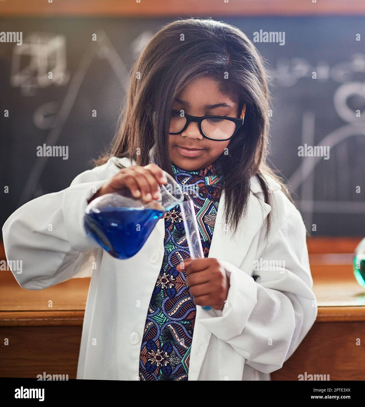I like to experiment. a cute little girl in a science lab Stock Photo ...